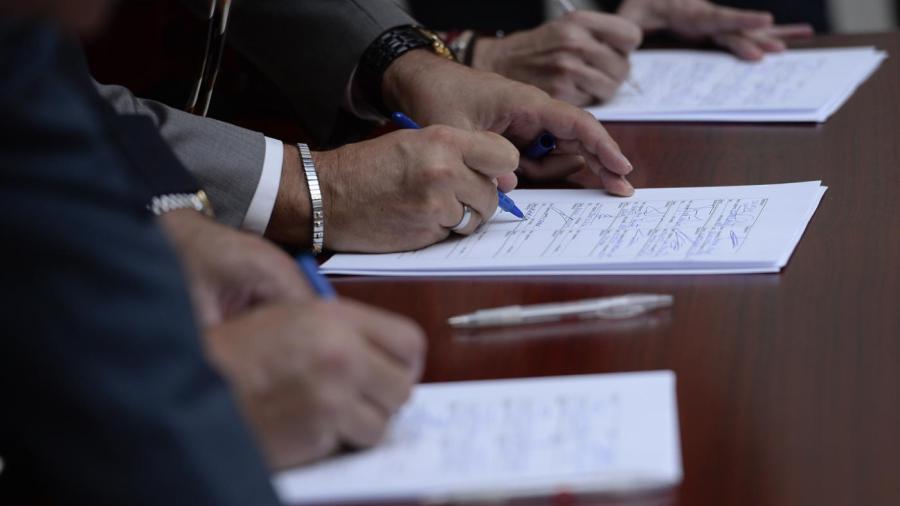 How Do You Sign Letters on Behalf of Someone Else?